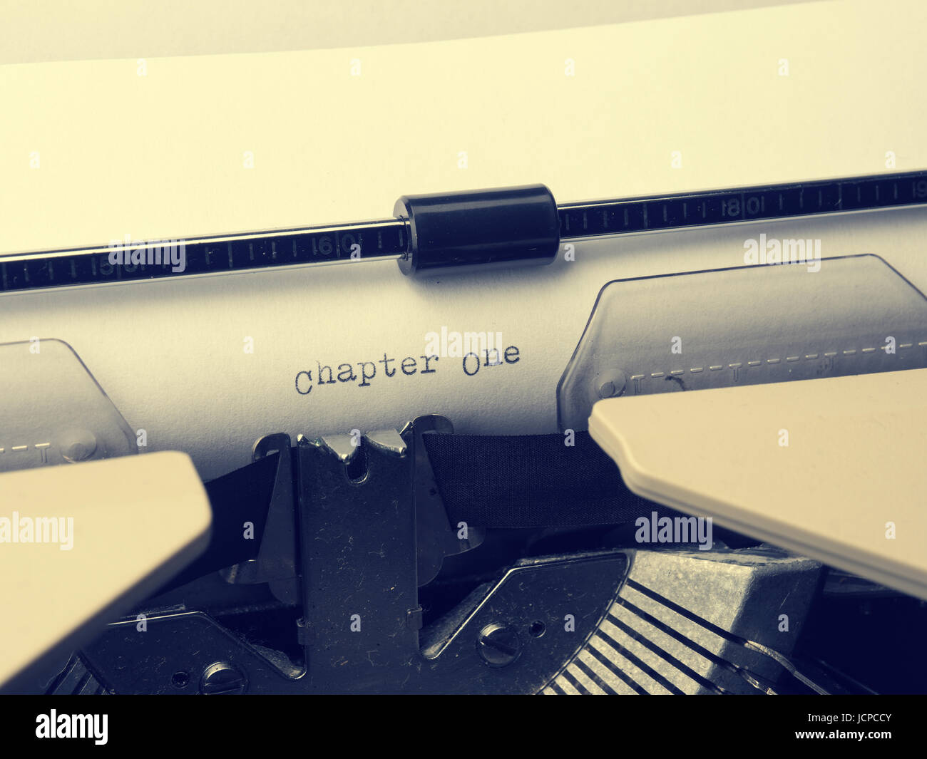 Close up of an old typewriter with a letter and the words Chapter one ...