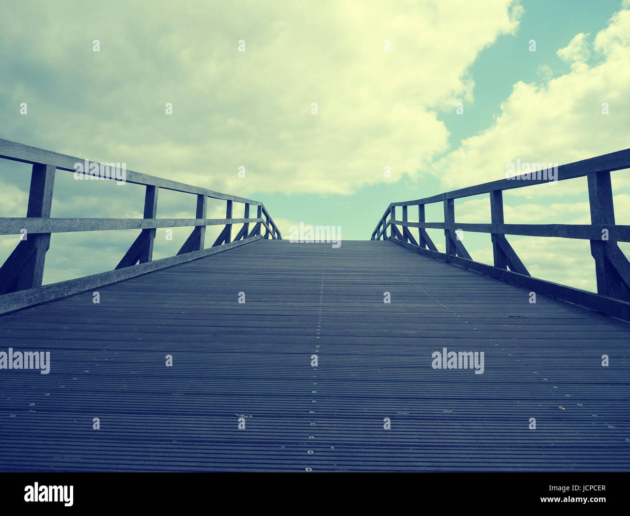 Wooden bridge into the sky with cloudy horizon, vintae style Stock ...