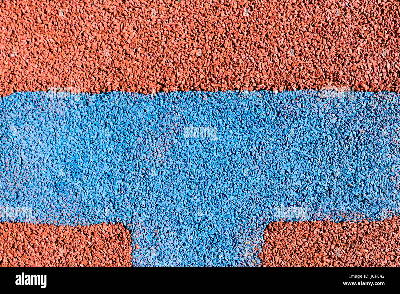 Rubber colored safety coating of sports playground closeup background ...