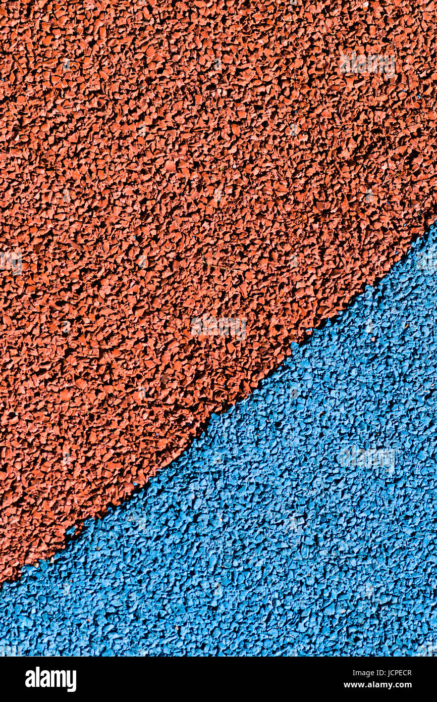 Rubber colored safety coating of sports playground closeup background ...