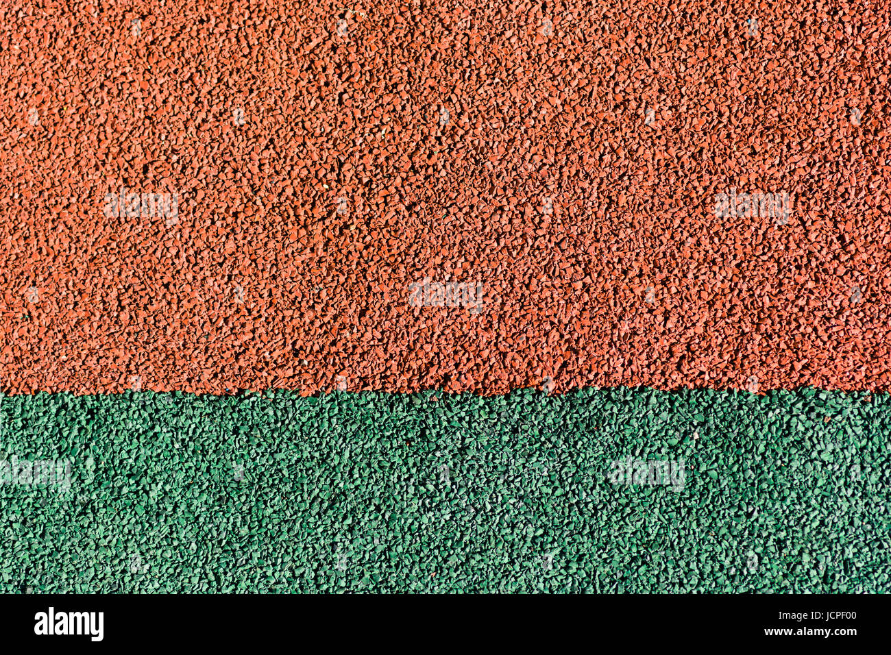 Rubber colored safety coating of sports playground closeup background ...