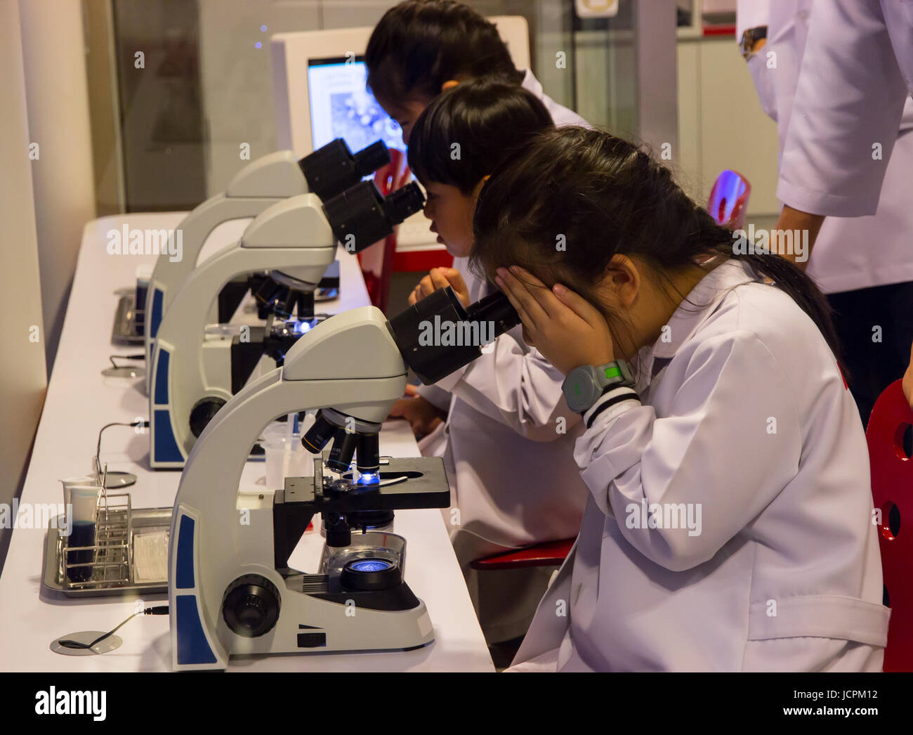 Bangkok, Thailand - April 29, 2017: Asian kids looking through ...
