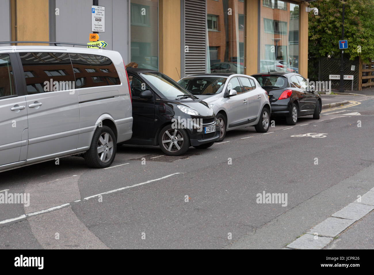 Smart car parked sideways Stock Photo - Alamy