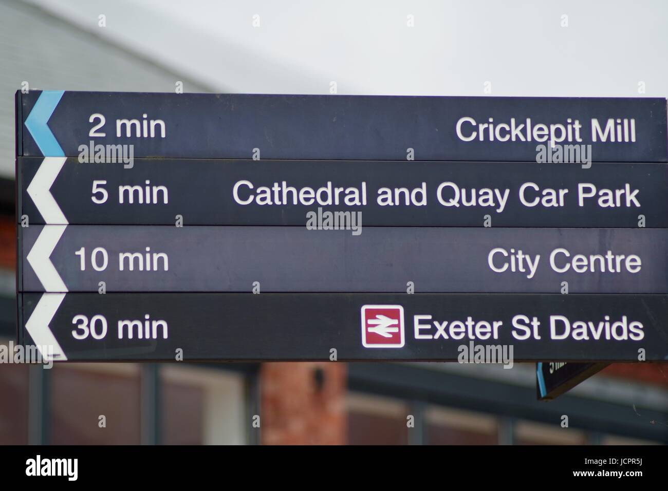 Sign Post with Estimated Walking Times. Exeter Quay, Devon, UK. June ...