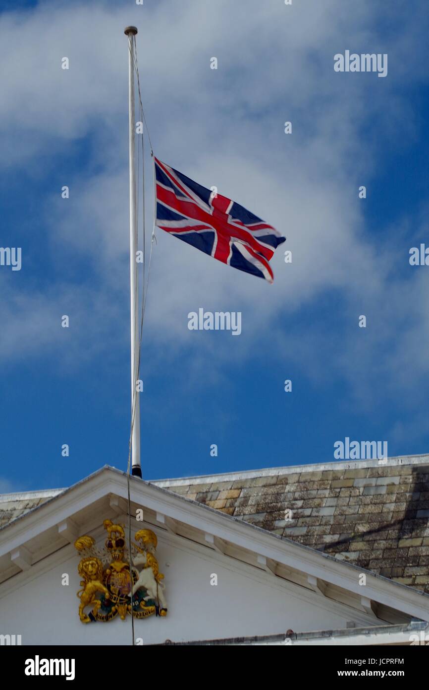 The Union Jack Flying at Half Mast above the Royal Coat of Arms at ...