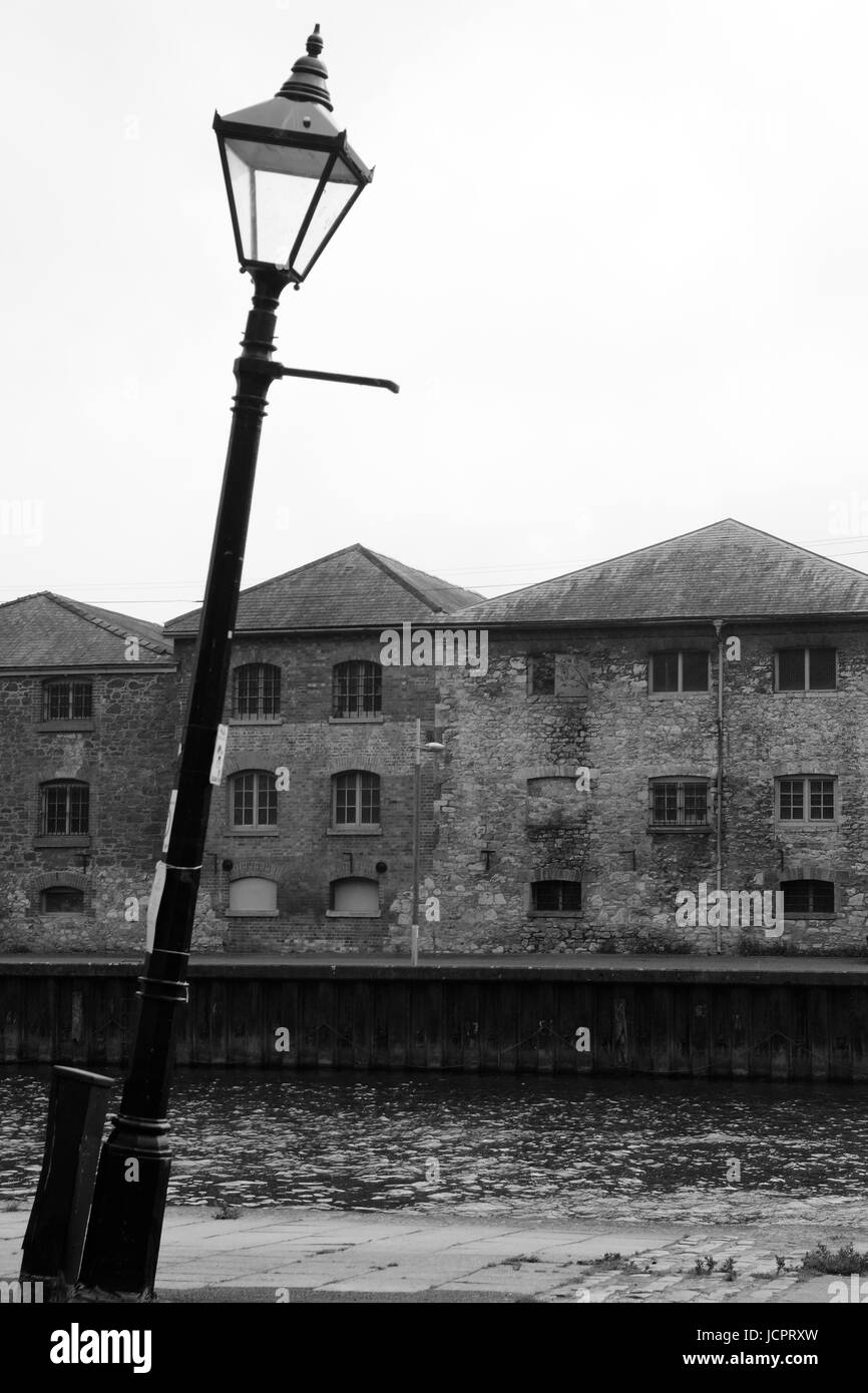 Old Leaning Lamp Post and Old Stone Maclaines Warehouses by the River ...