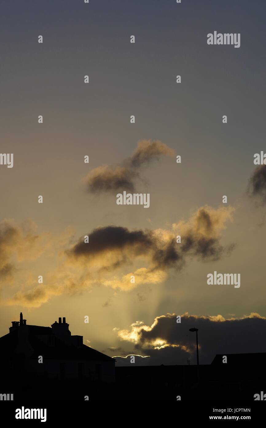 A Golden Sunset at Exeter Quay Silhouetting Rooftops and Chimney Pots ...