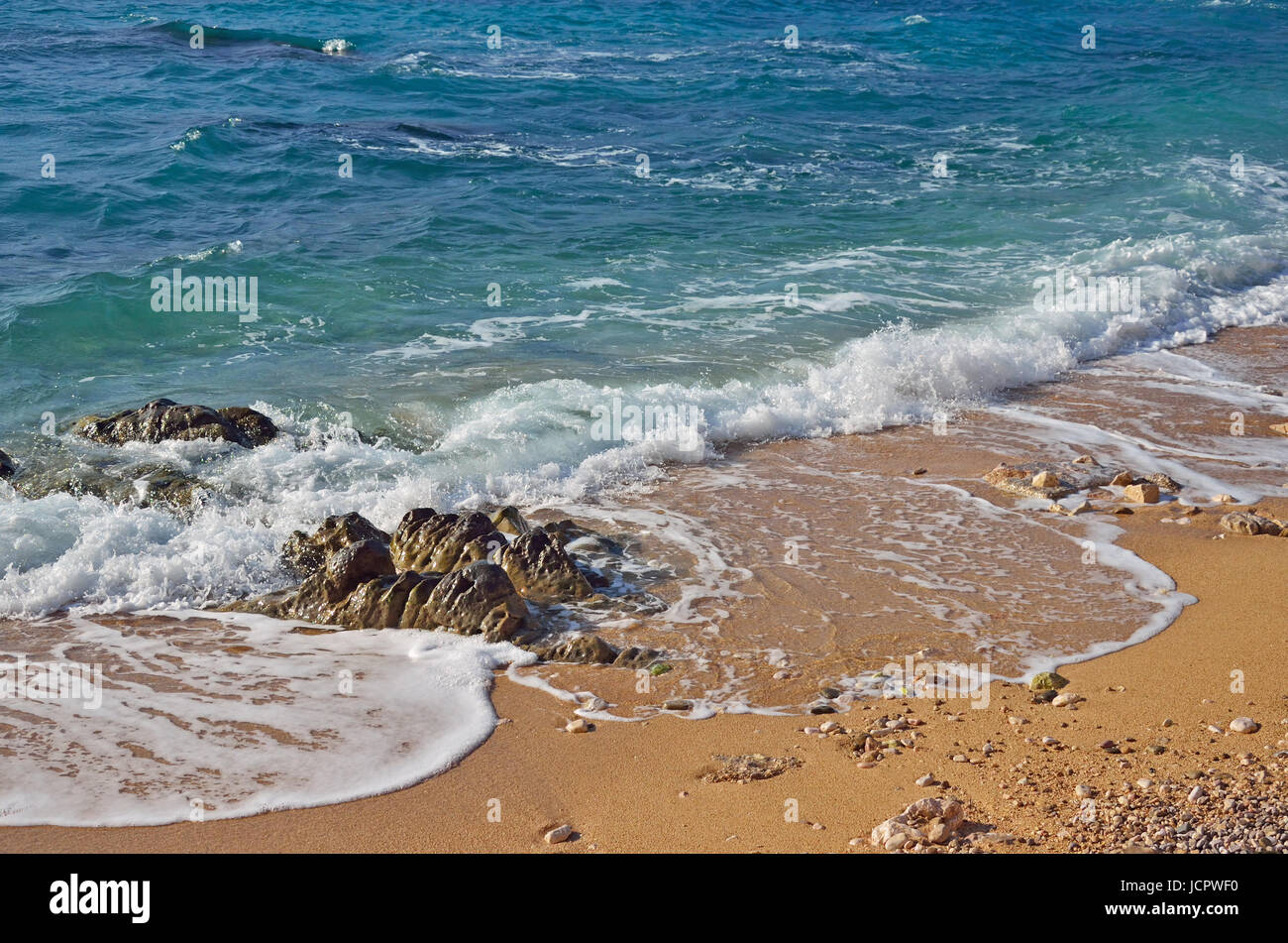 Wave crashing onto a beach hi-res stock photography and images - Alamy