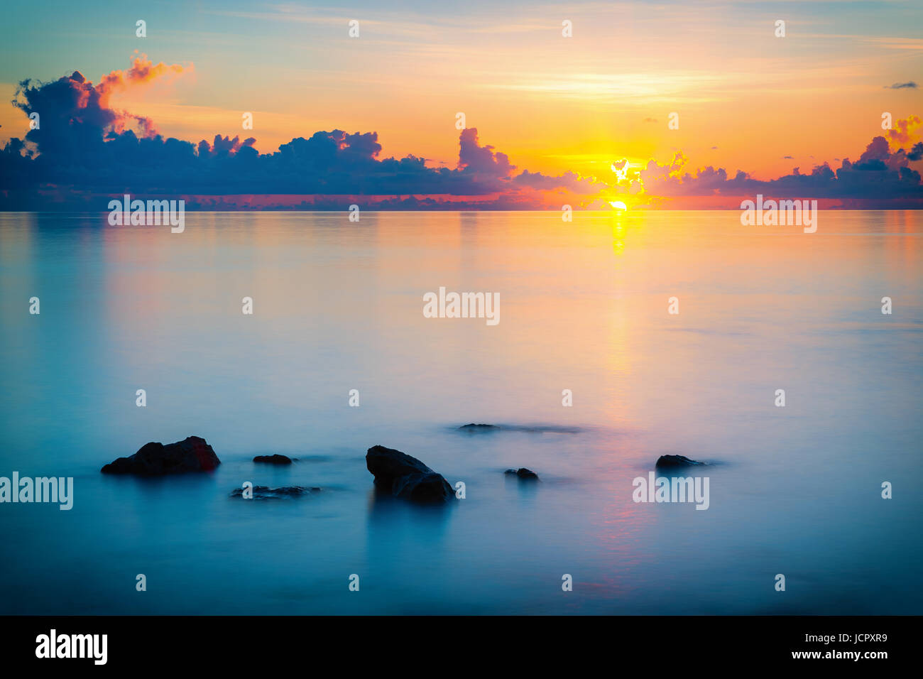 Colorful sunrise over ocean on Maldives Stock Photo - Alamy