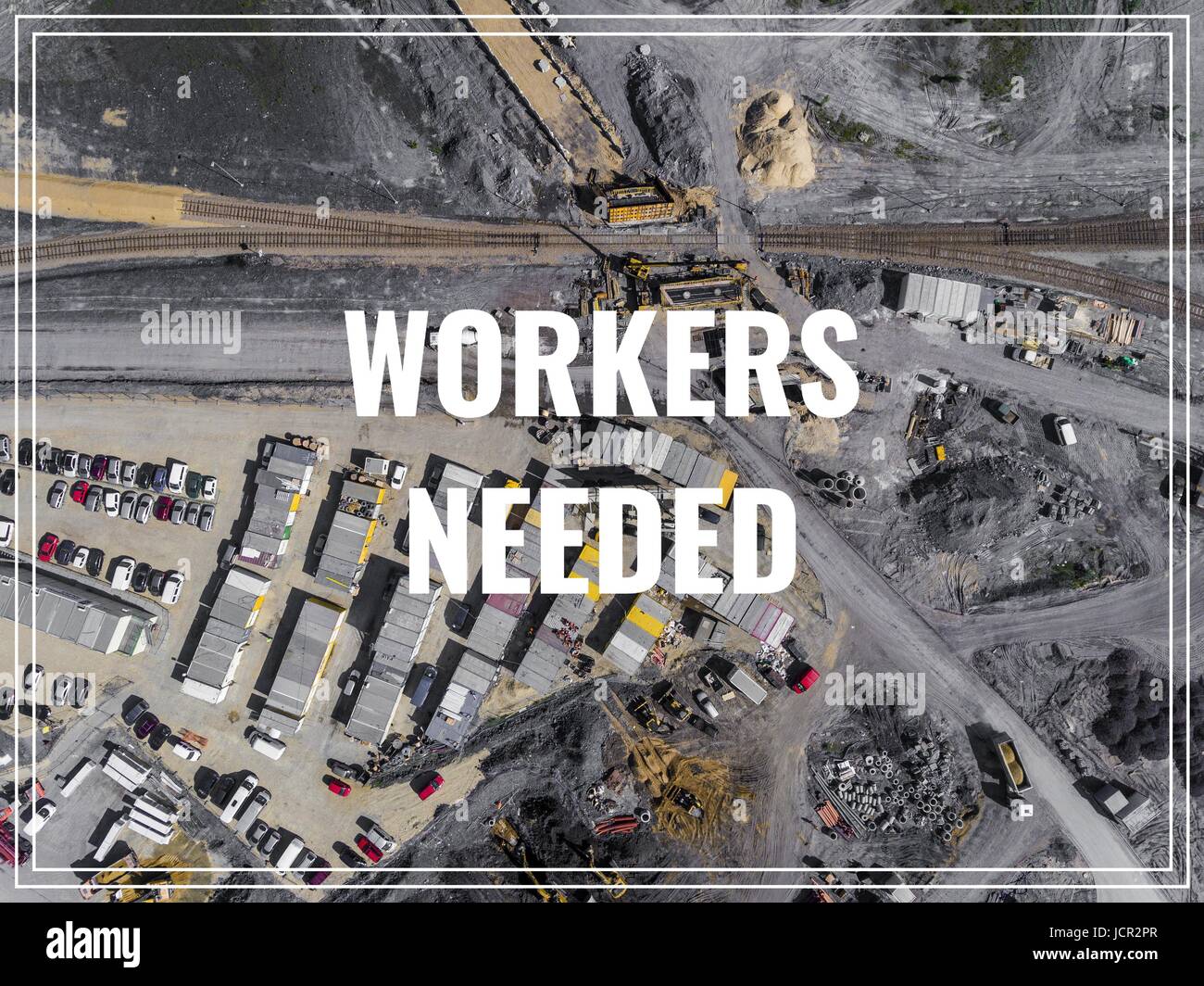 Word Workers Needed over industrial place from above Stock Photo - Alamy