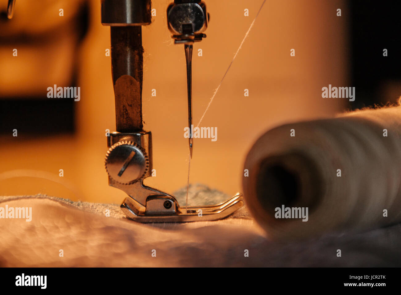 Sewing machine, sewing process, thread next to machines, pause to ...