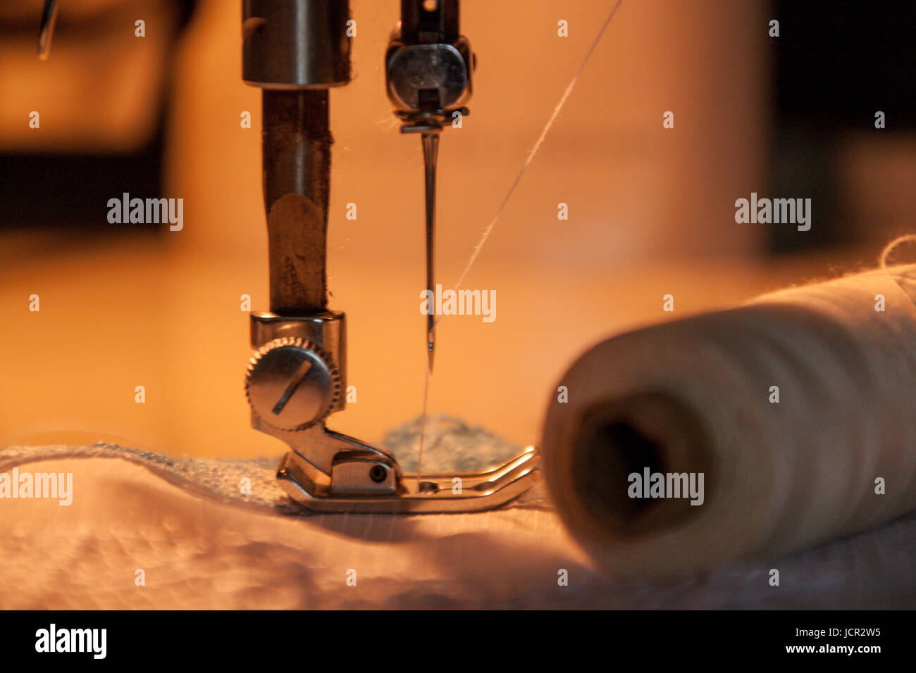 Sewing machine, sewing process, thread next to machines, pause to ...