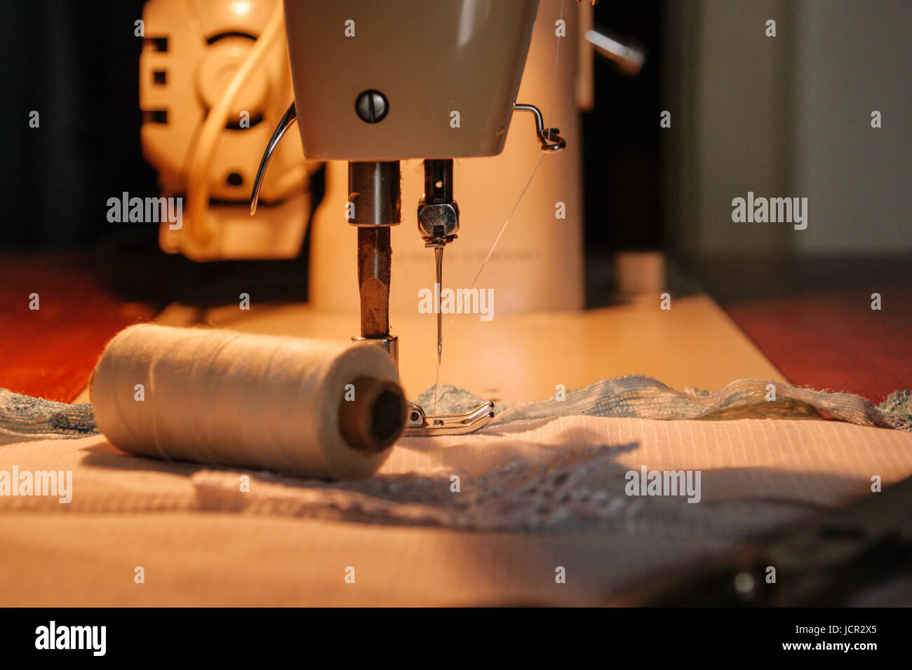 Sewing machine, sewing process, thread next to machines, pause to ...