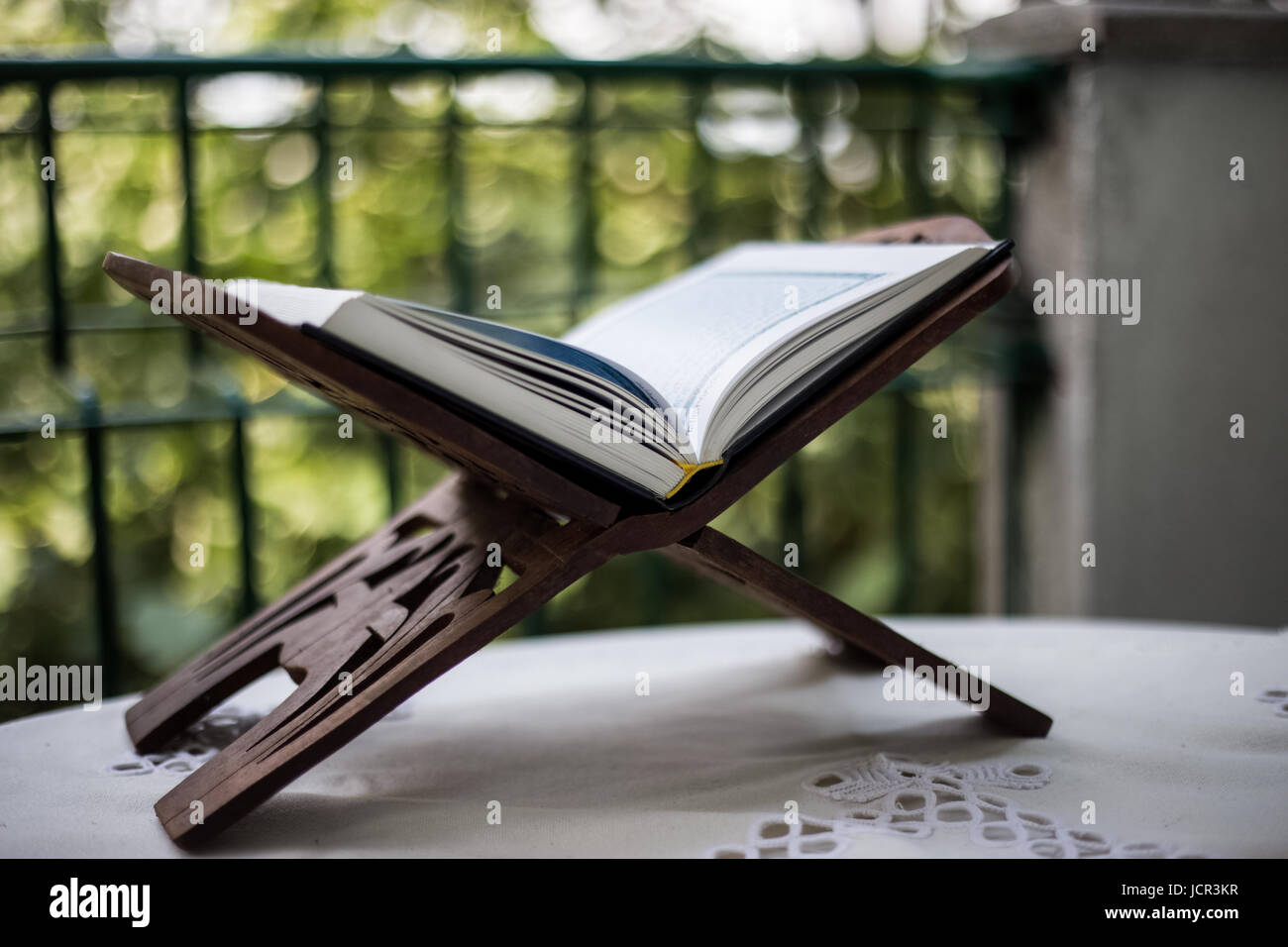 Quran-holy book of Muslims, an open book on a stand with rosary Stock ...