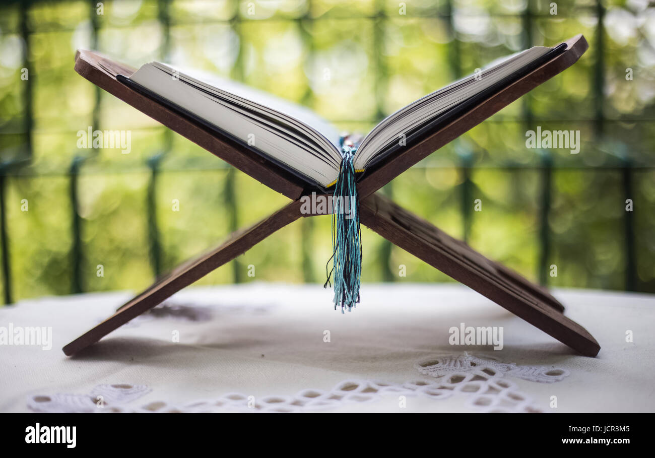 Quran-holy book of Muslims, an open book on a stand with rosary Stock ...
