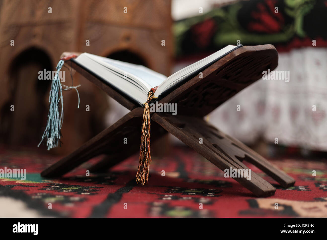 Quran-holy book of Muslims, an open book on a stand with rosary Stock ...
