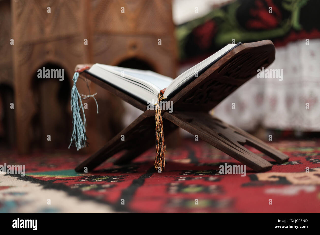 Quran-holy book of Muslims, an open book on a stand with rosary Stock ...