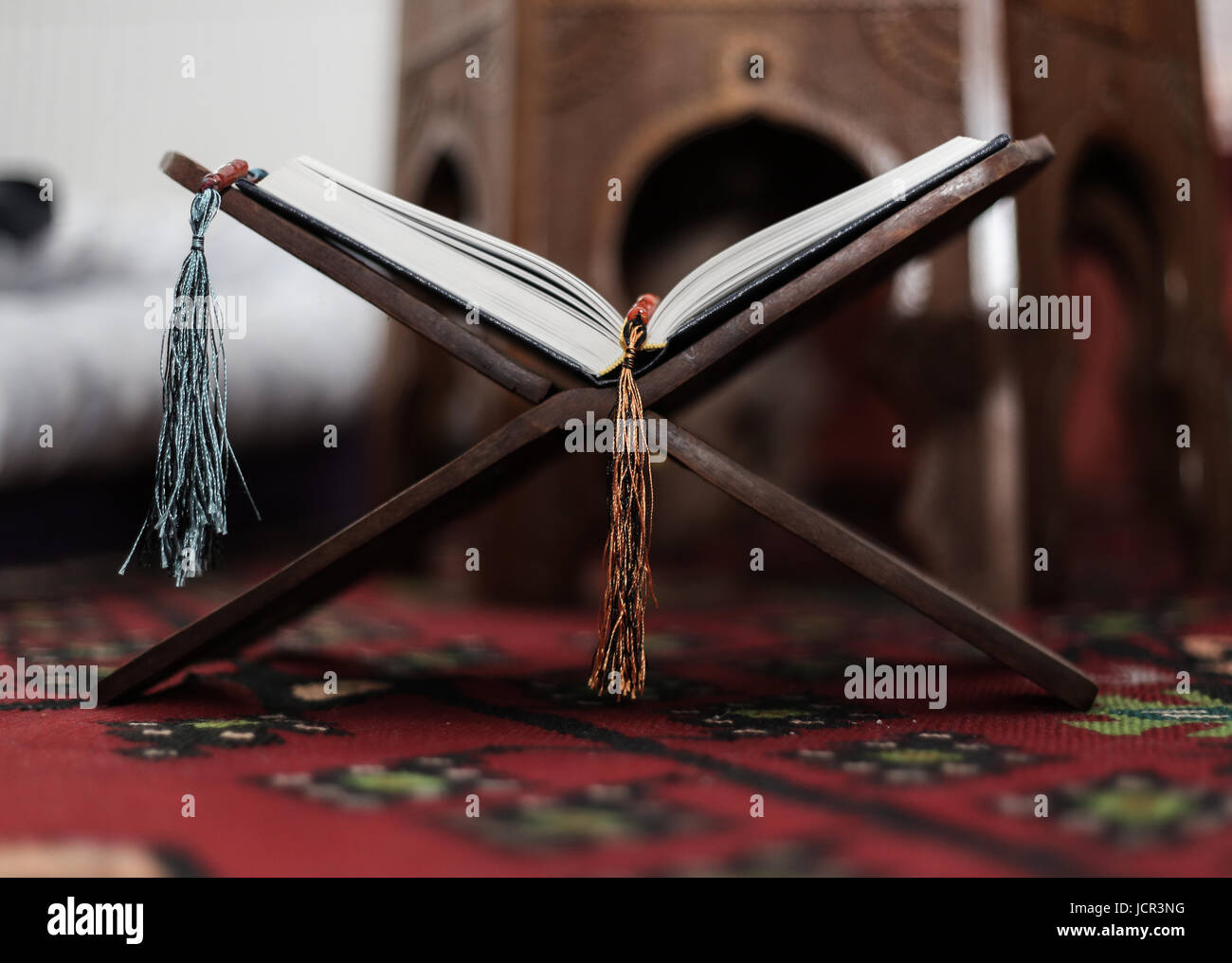 Quran-holy book of Muslims, an open book on a stand with rosary Stock ...