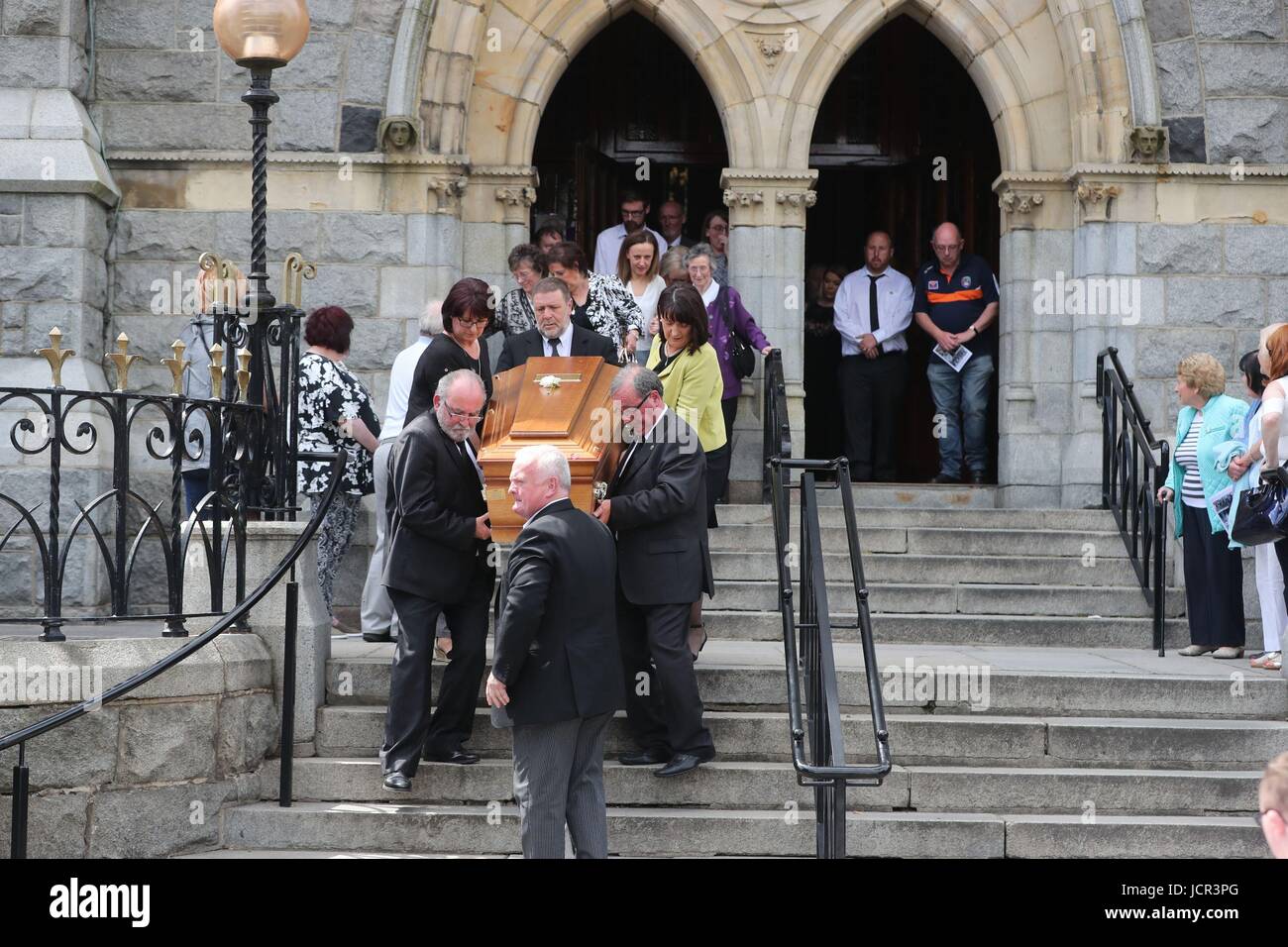 The coffin is carried from St Catherine's Dominican Chapel in Newry Co ...