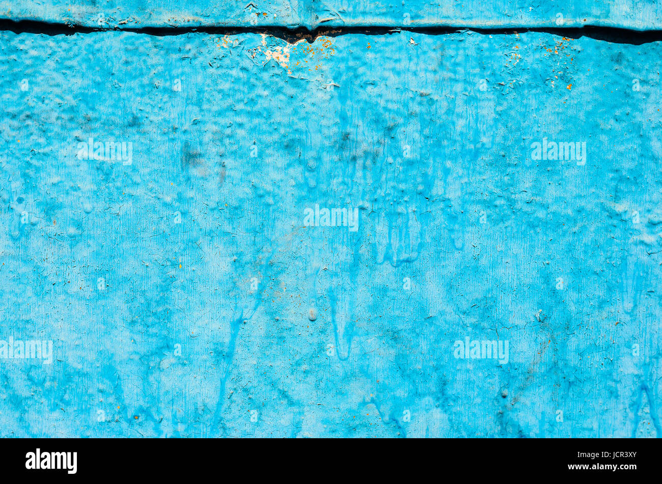 Cracked paint on old metal texture. Blue color. Rusted surface. Joint ...
