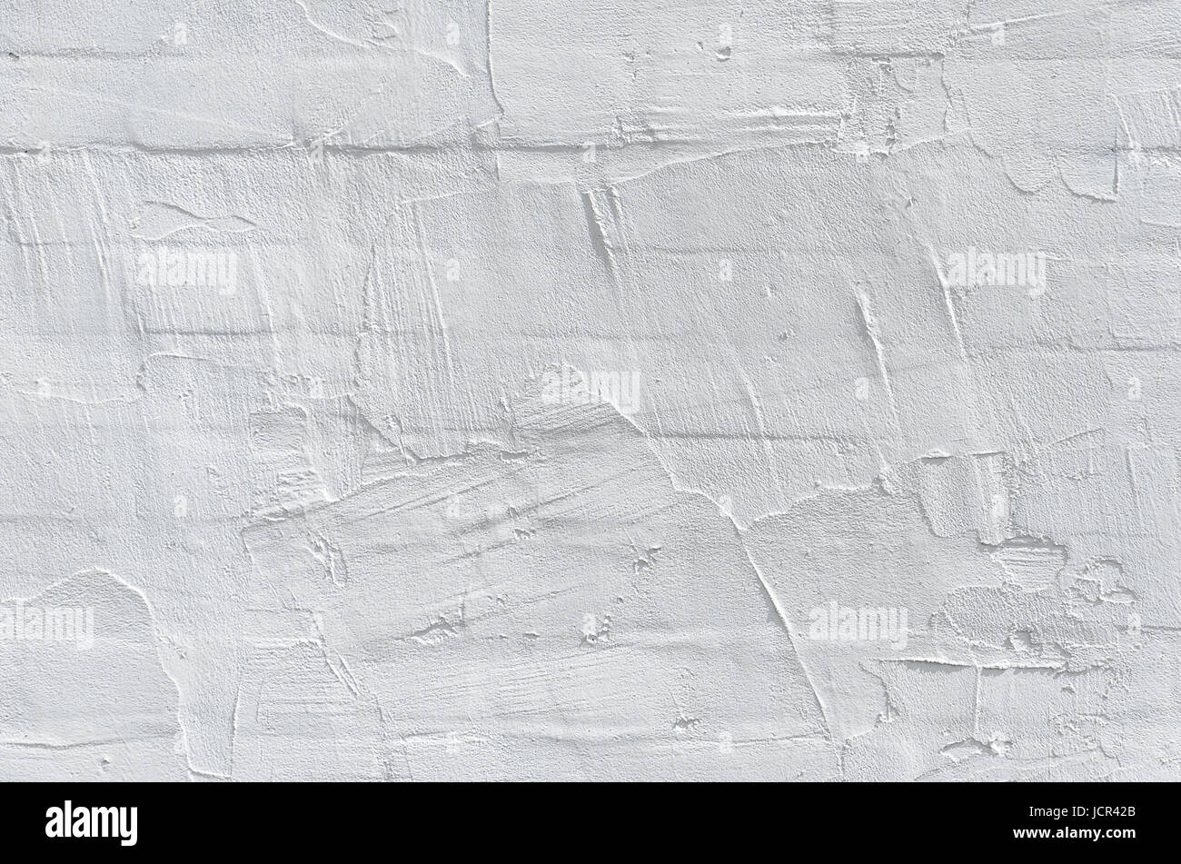 Thin layer of plaster on a brick wall. White plaster wall texture ...