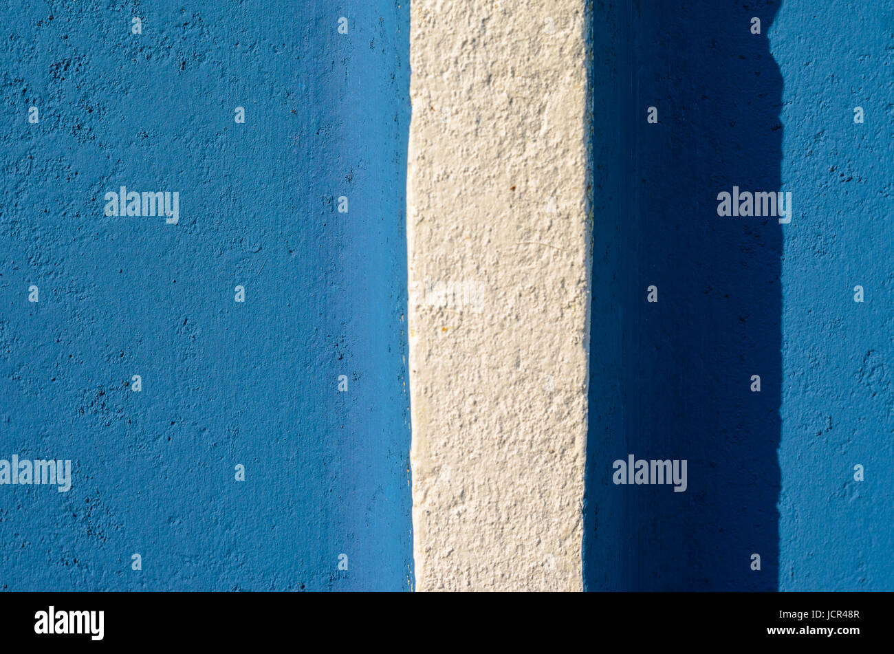 Blue plaster wall texture with white vertical stripe . Empty plaster ...