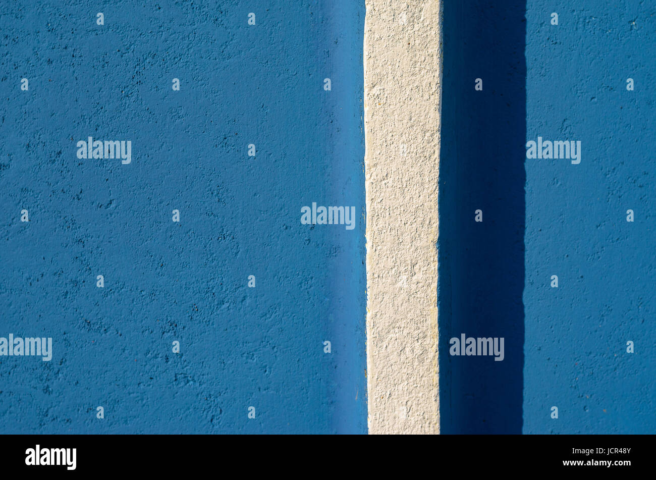 Blue plaster wall texture with white vertical stripe . Empty plaster ...