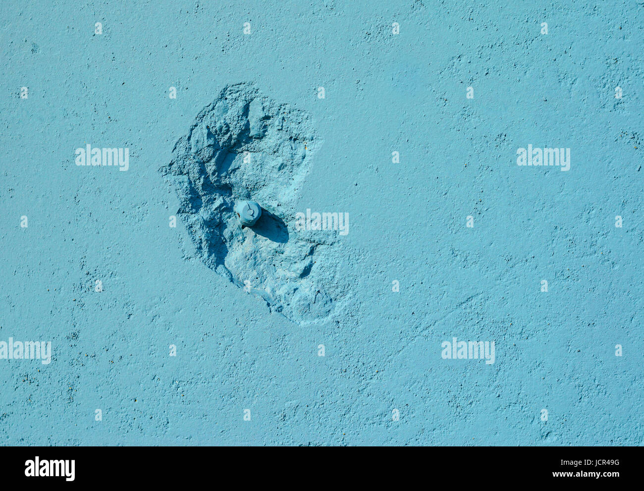 Blue plaster wall texture with protruding fittings. Empty plaster ...