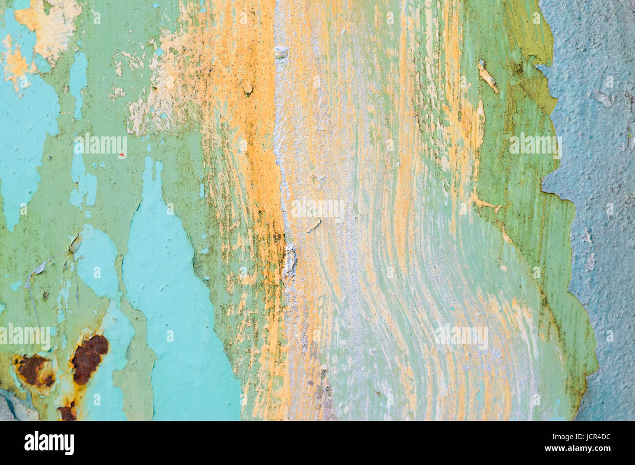 Yellow paint smears on a metal surface. Old metal texture for ...