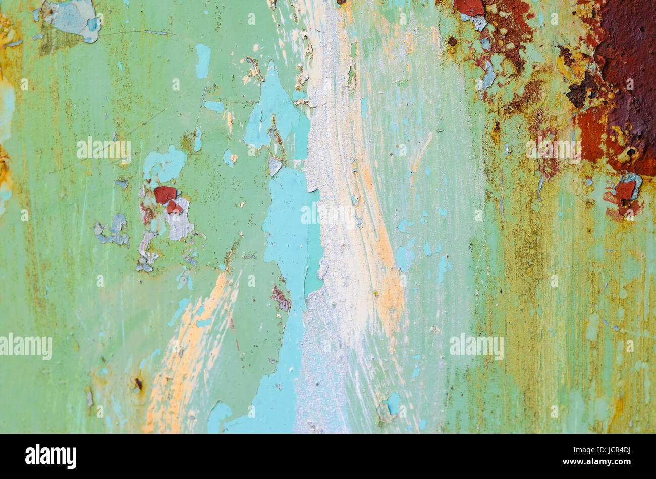 Yellow paint smears on a metal surface. Old metal texture for ...