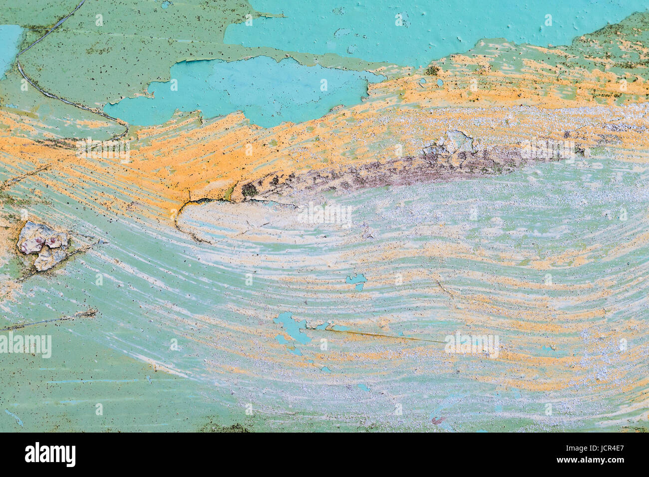 Yellow paint smears on a metal surface. Old metal texture for ...