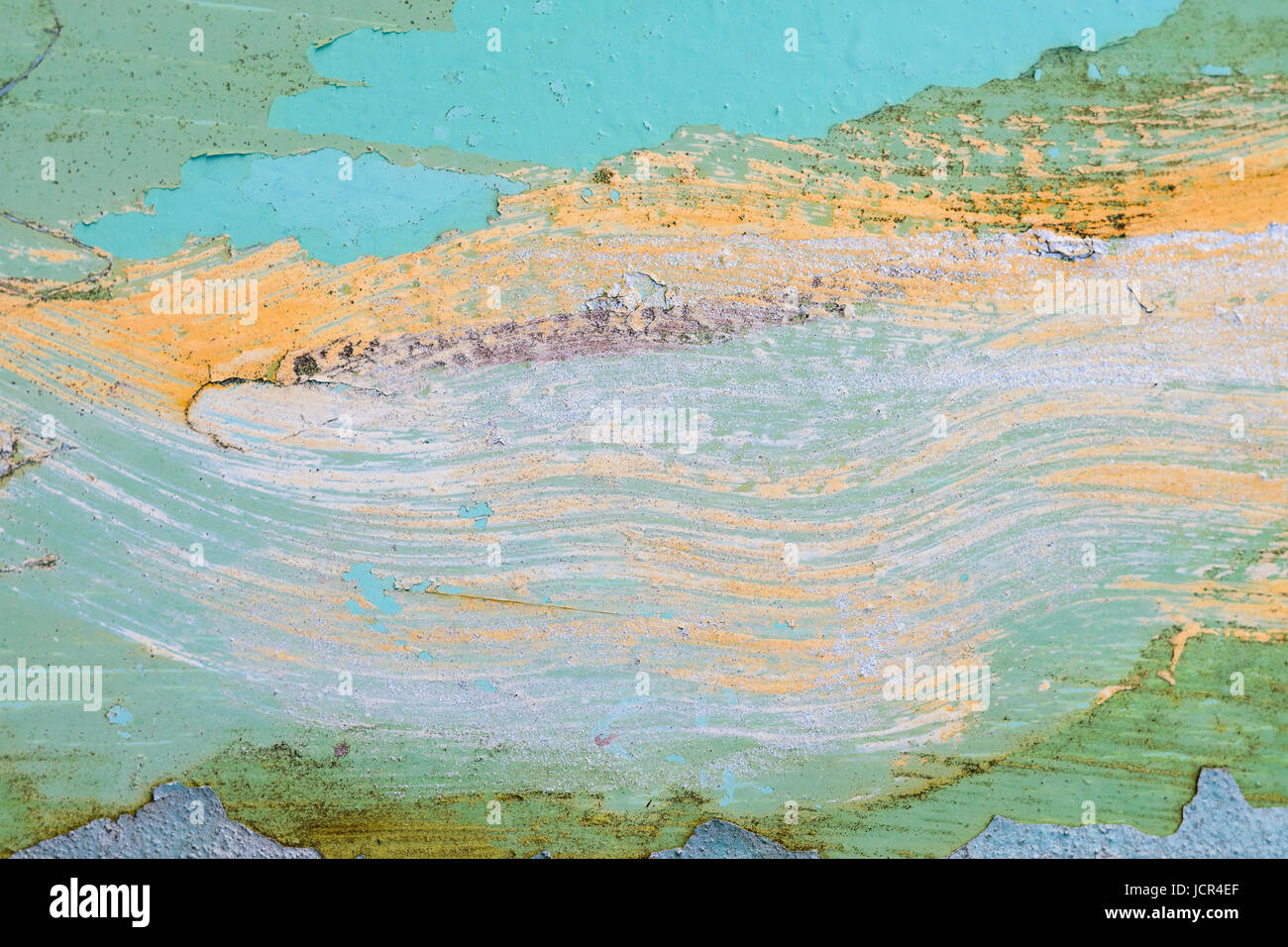 Yellow paint smears on a metal surface. Old metal texture for ...