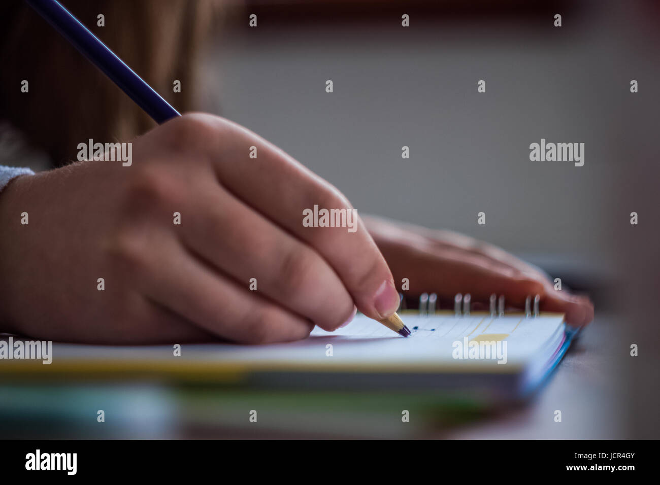 Girl taking notes hi-res stock photography and images - Alamy