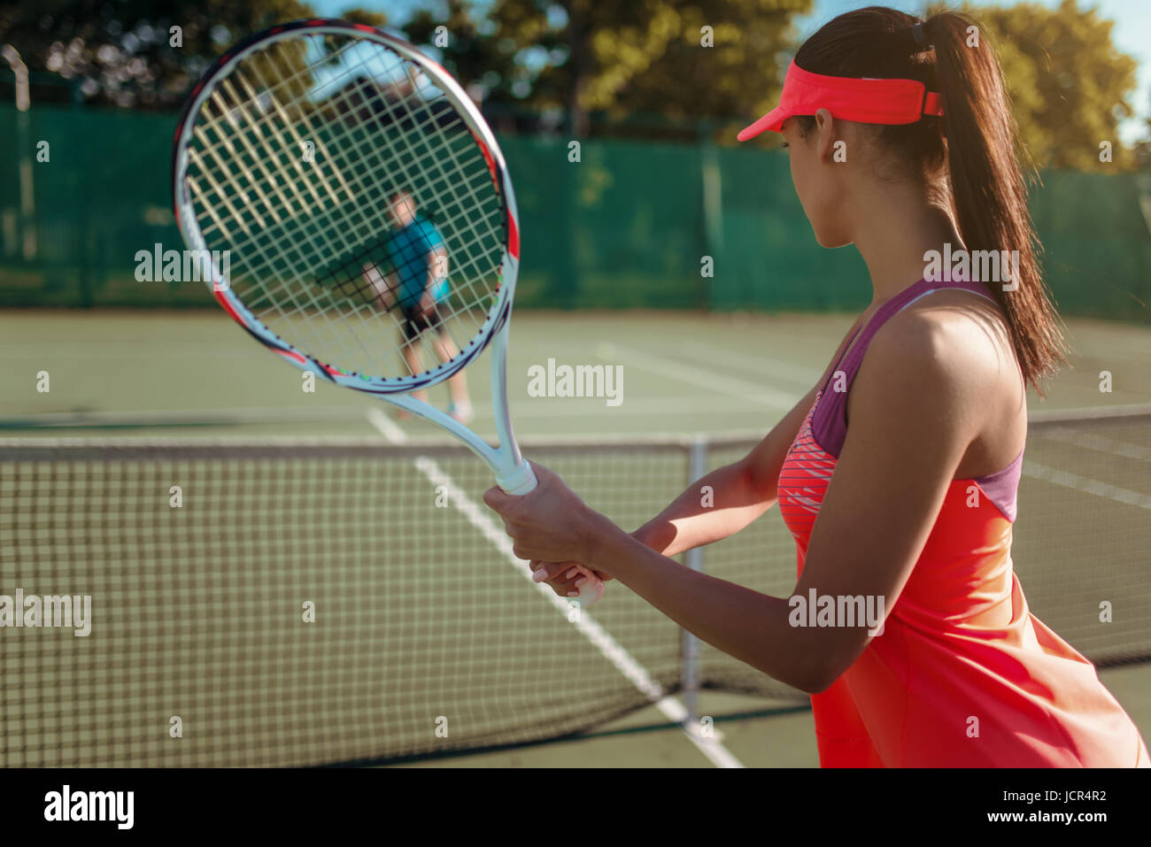 Couple playing tennis on outdoor court. Summer season active sport game ...