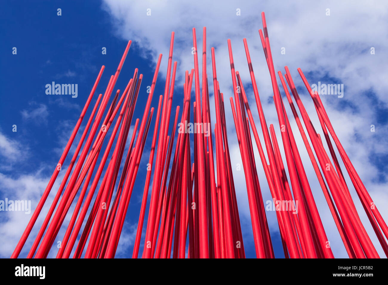 Red Rods shooting upwards to the sky Stock Photo - Alamy