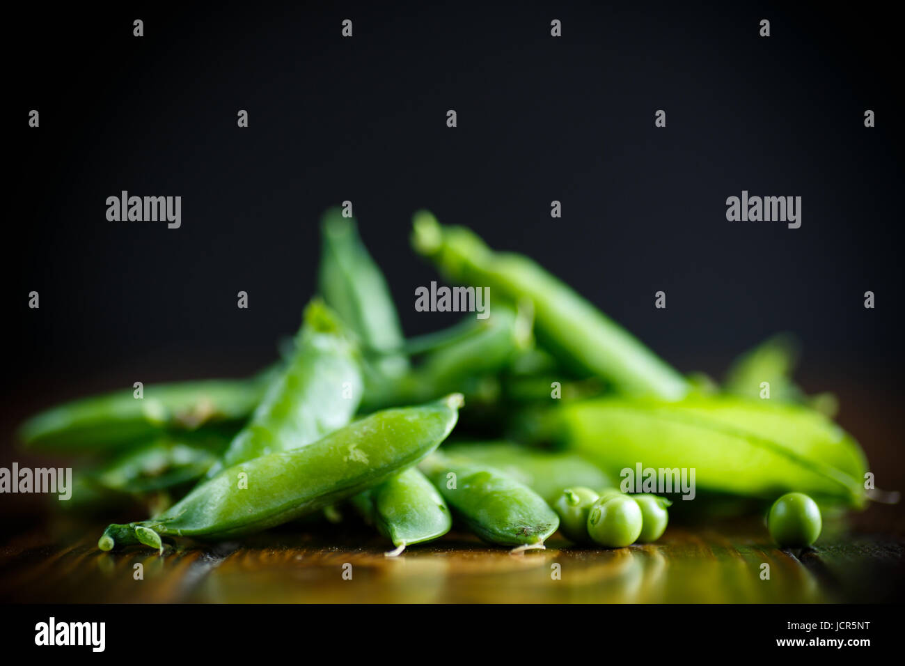 Fresh early green peas Stock Photo - Alamy