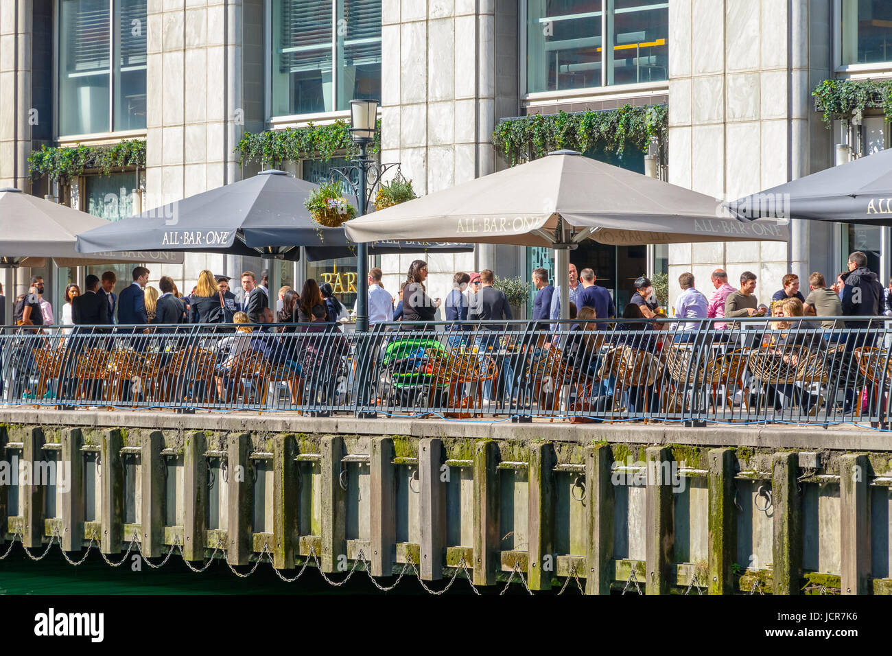 London, UK - May 10, 2017 - Dockside bar in Canary Wharf packed with ...