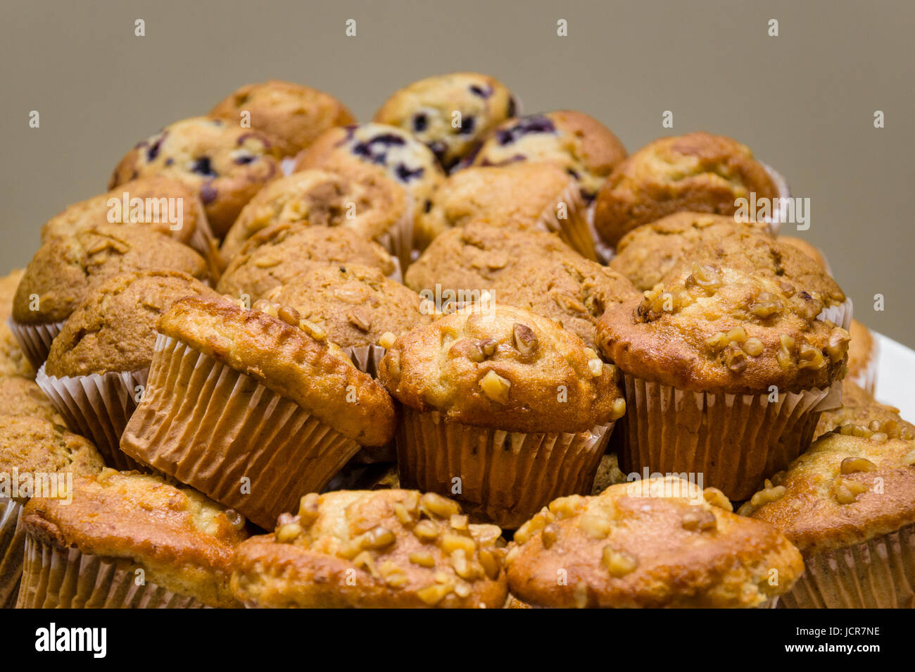 Plate of fresh blueberry and nut muffins in the serving line Stock ...