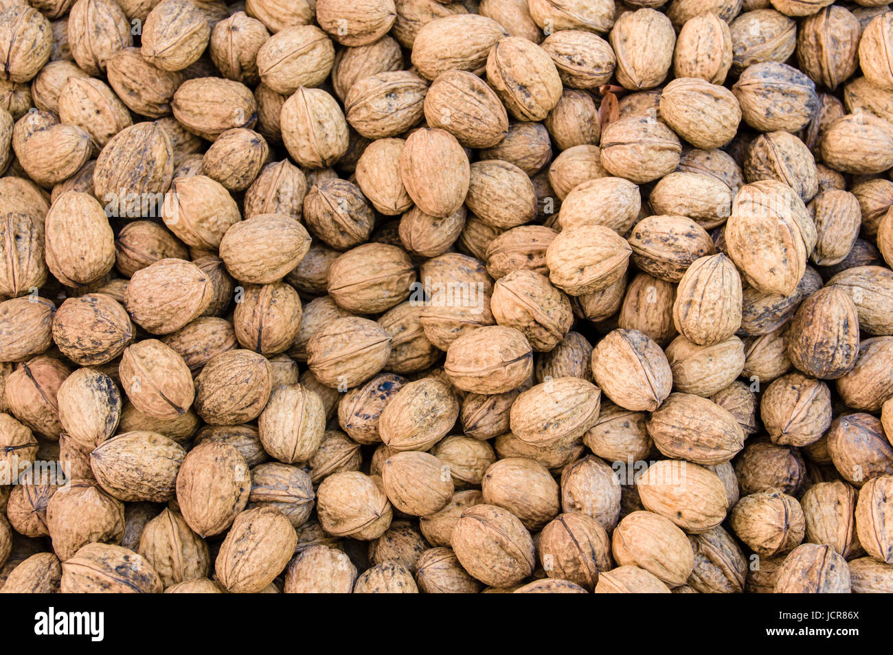 Dry walnuts in bulk at the farmers market Stock Photo - Alamy