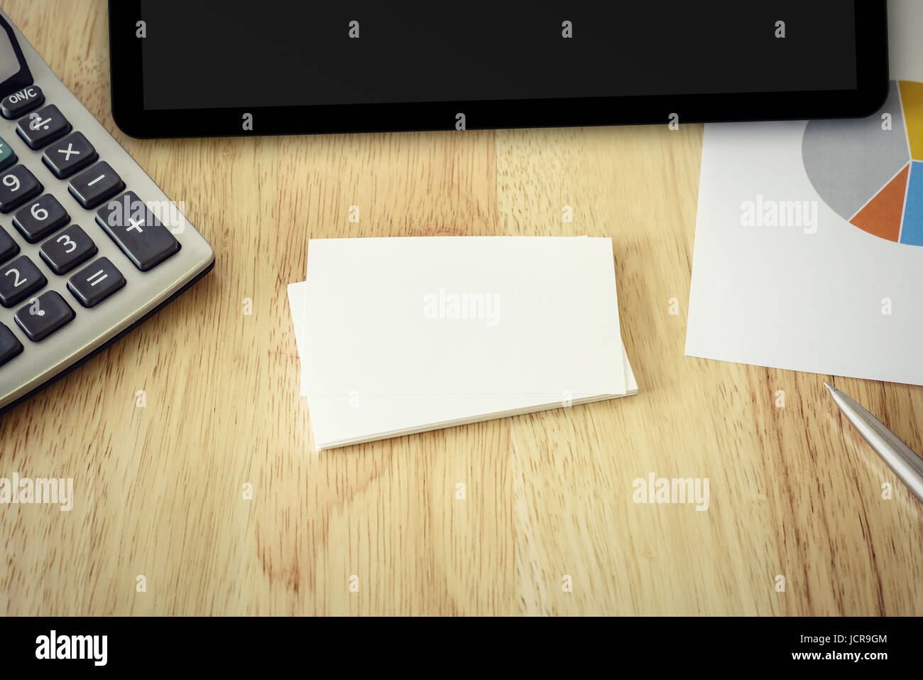 name card graph with calculator and tablet, vintage effect Stock Photo ...