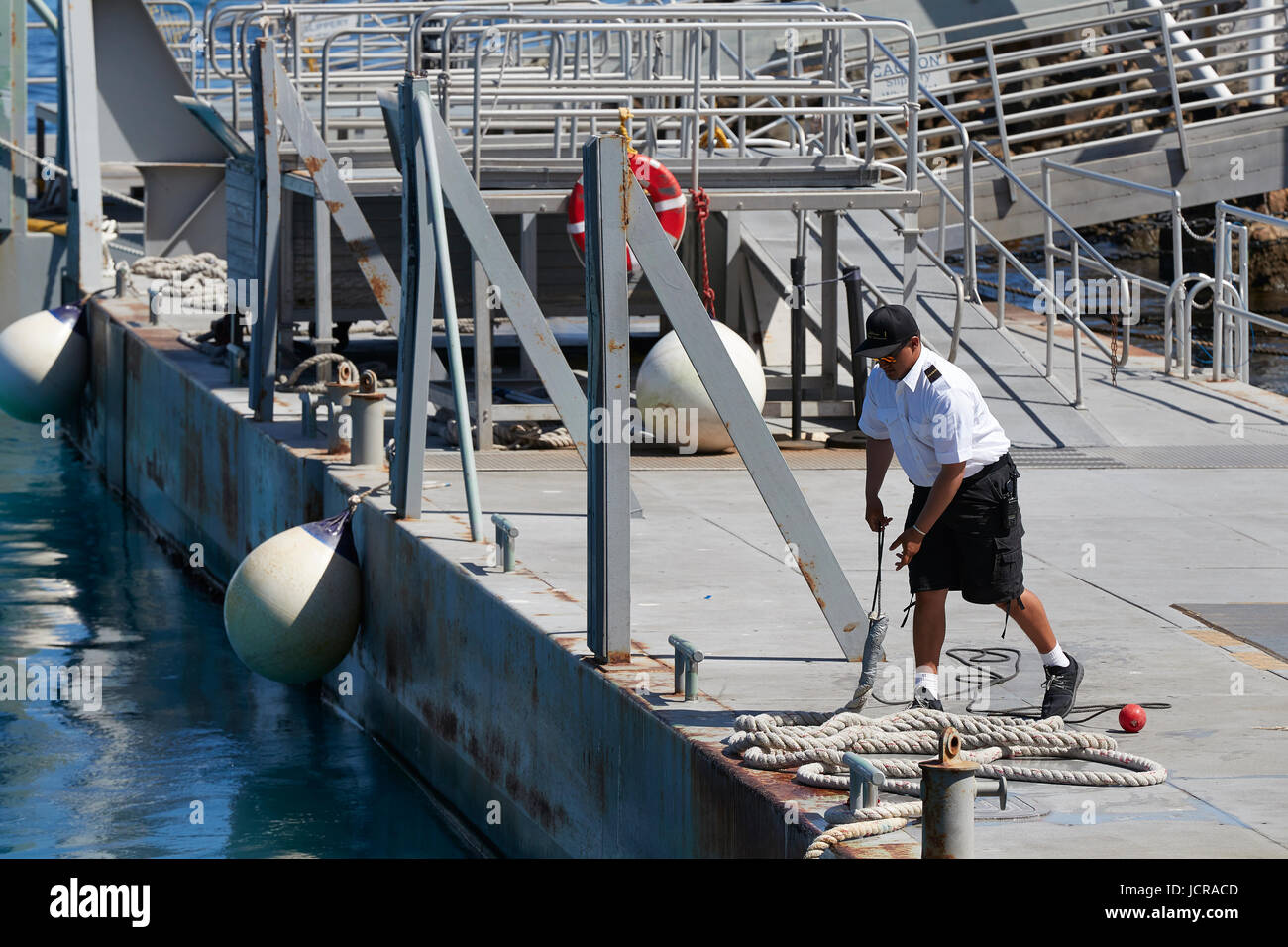 Deck Hand Arranges The Mooring Ropes On The Catalina Express Dock In ...