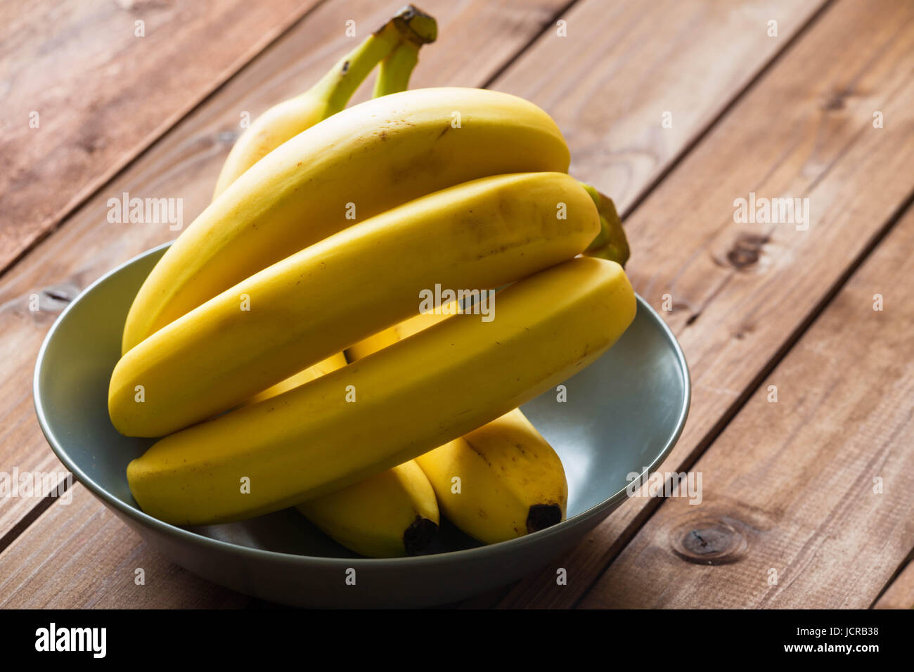Bananas of the table Stock Photo - Alamy