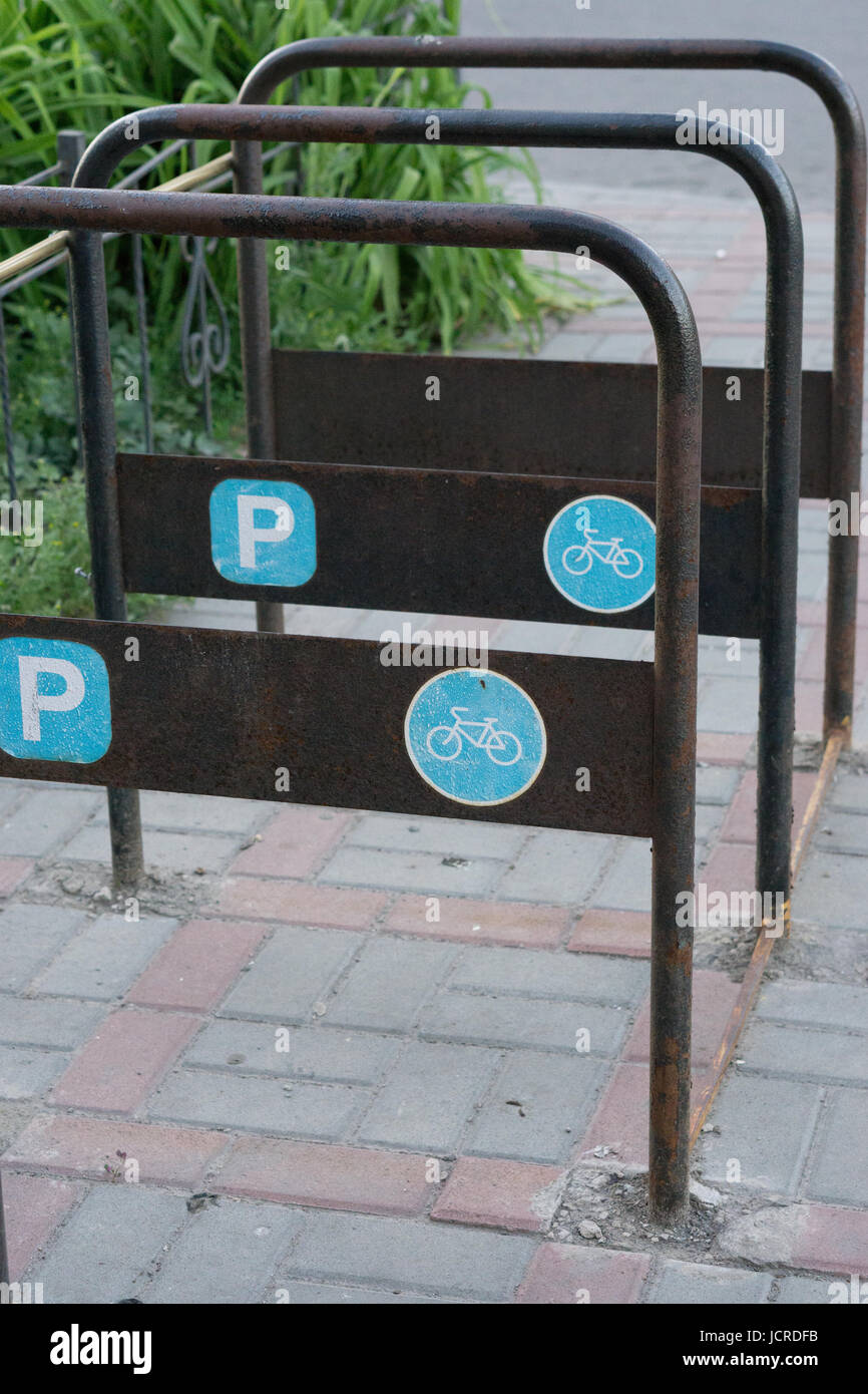 metal bicycle parking and mosaic paths from a stone in the modern city ...