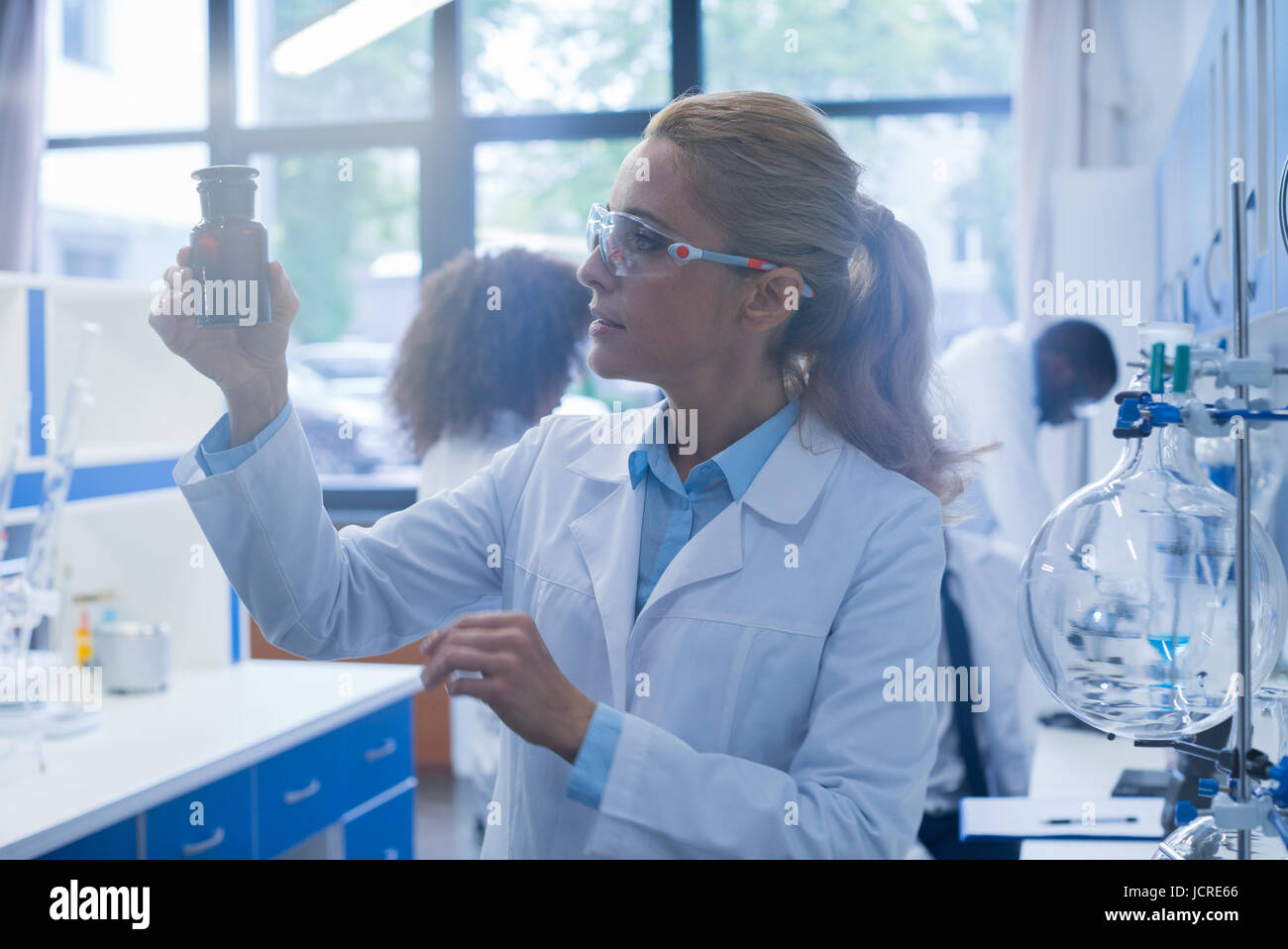 Young Woman Working In Laboratory Doing Research, Female Scientist ...