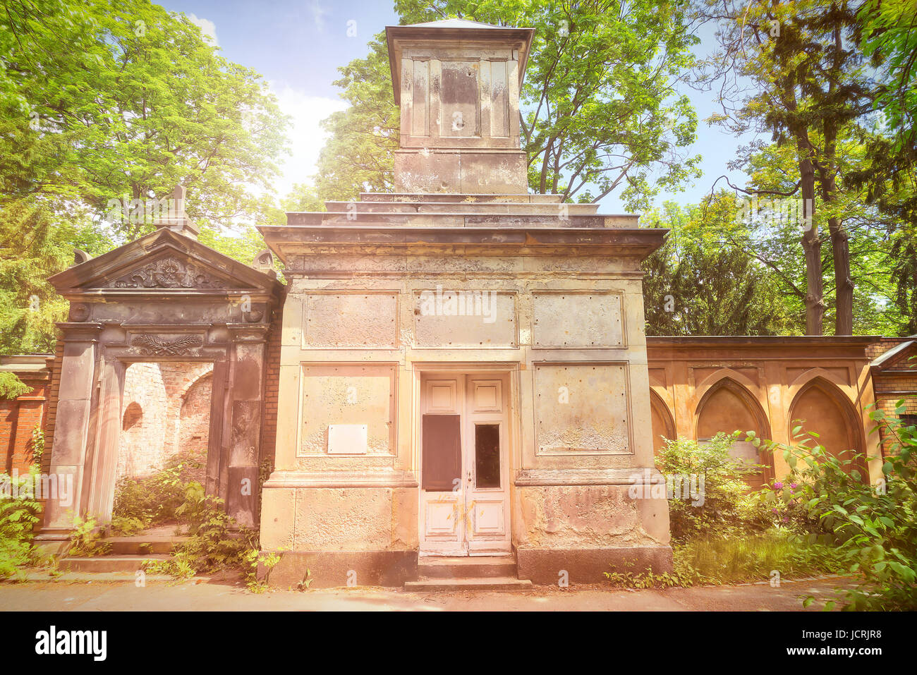 idyllic place, old sun-washed tomb in spring Stock Photo - Alamy
