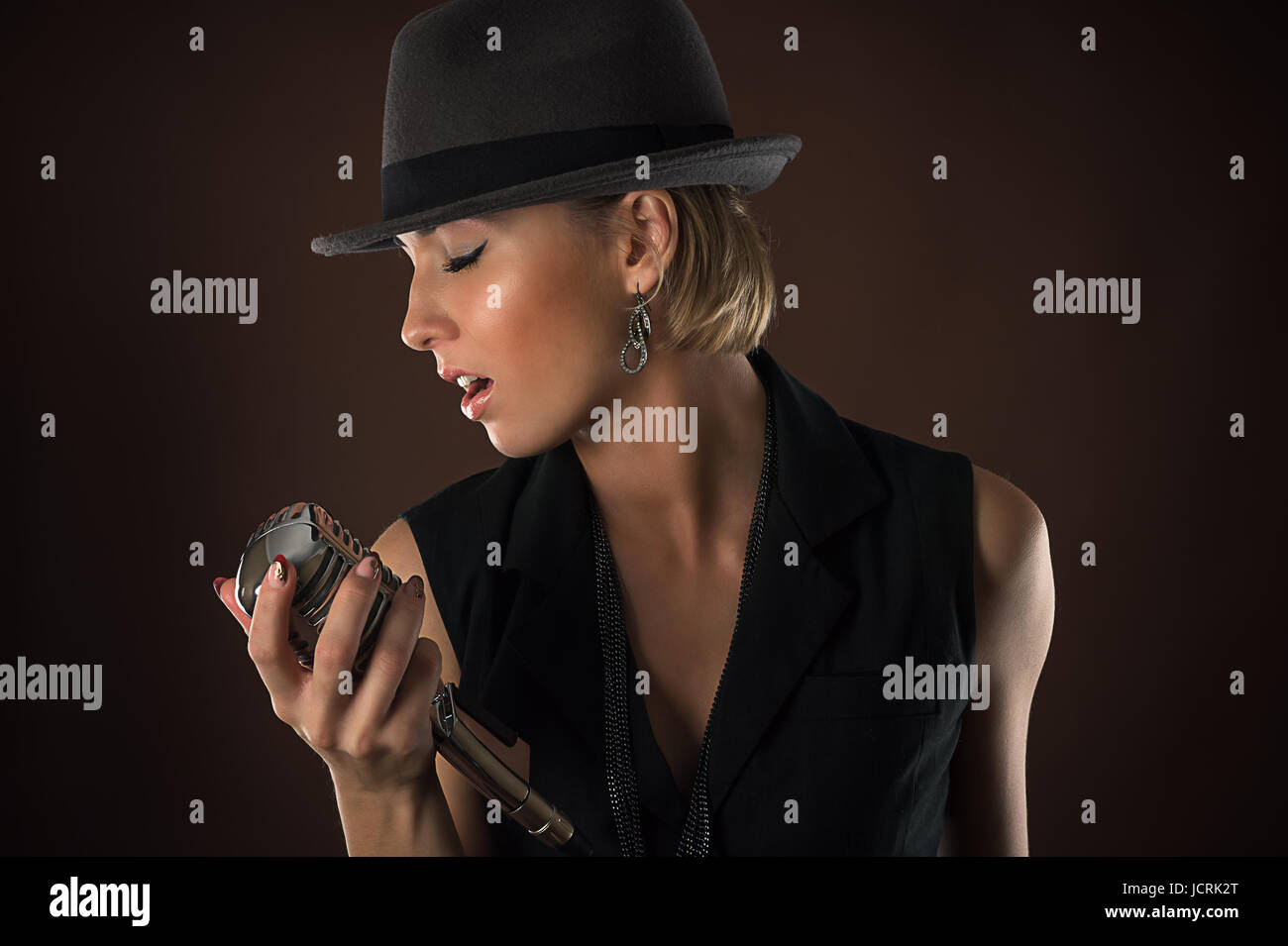 stylish woman with retro microphone Stock Photo - Alamy