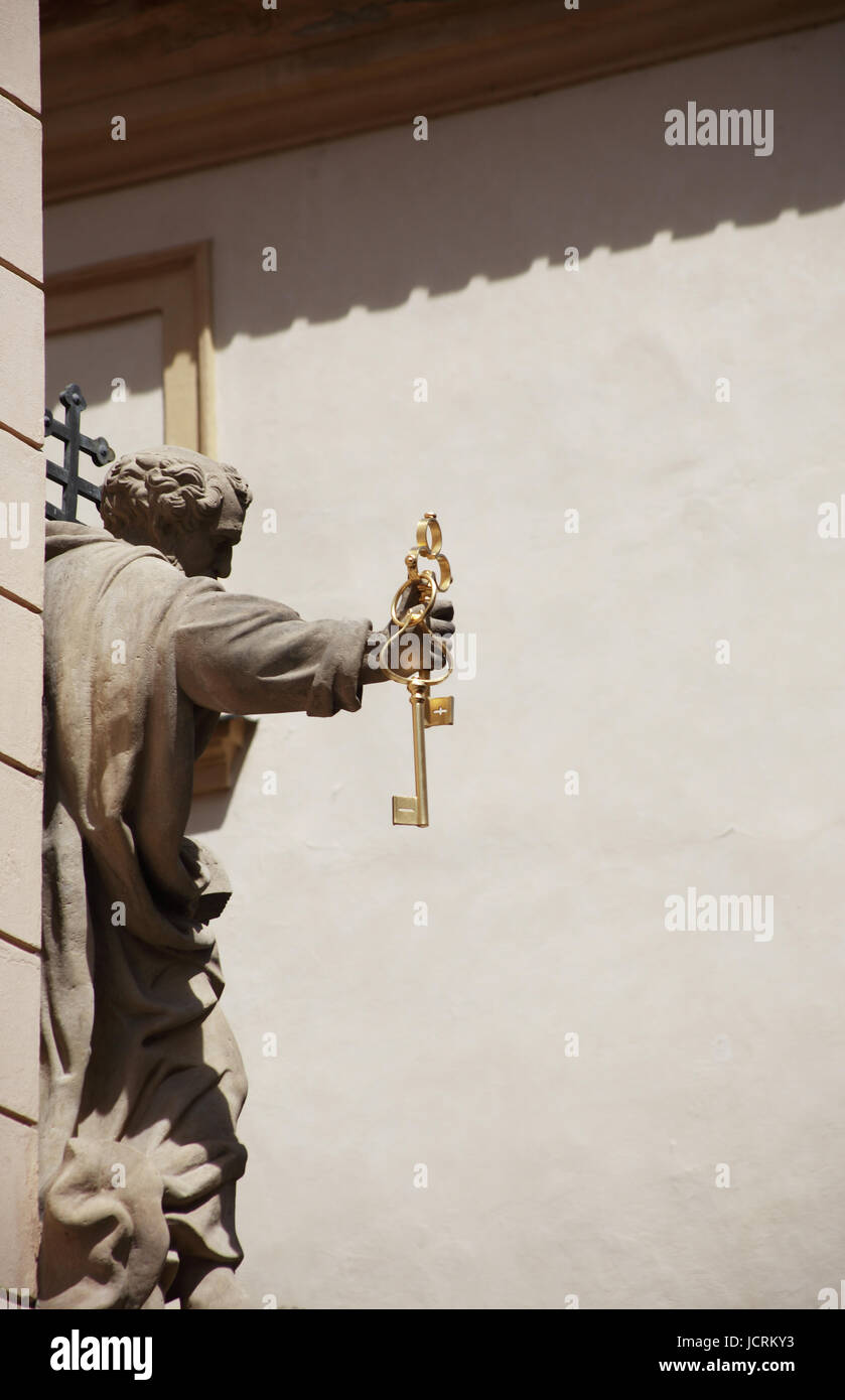 Statue of St. Peter holding gold key to heaven. Prague,Czech Republic ...