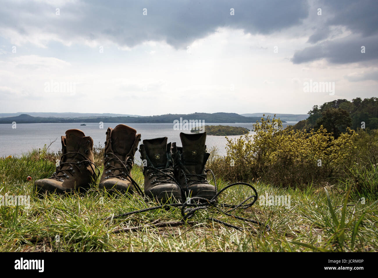 Hiking boots in front of beautiful lake Stock Photo - Alamy