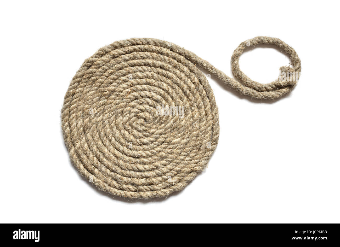 Coil of old hemp rope on white background Stock Photo - Alamy