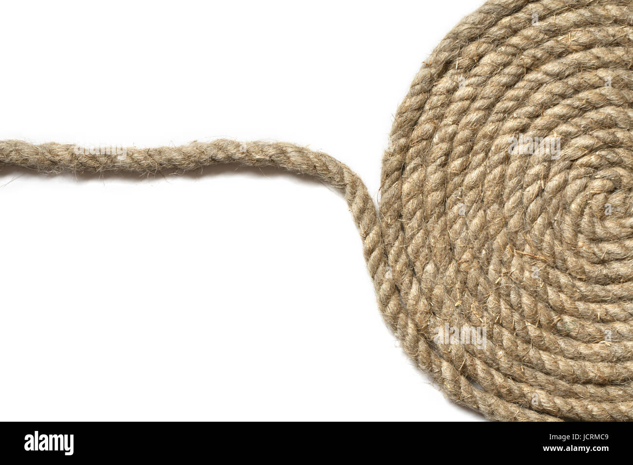 Coil of old hemp rope on white background Stock Photo - Alamy